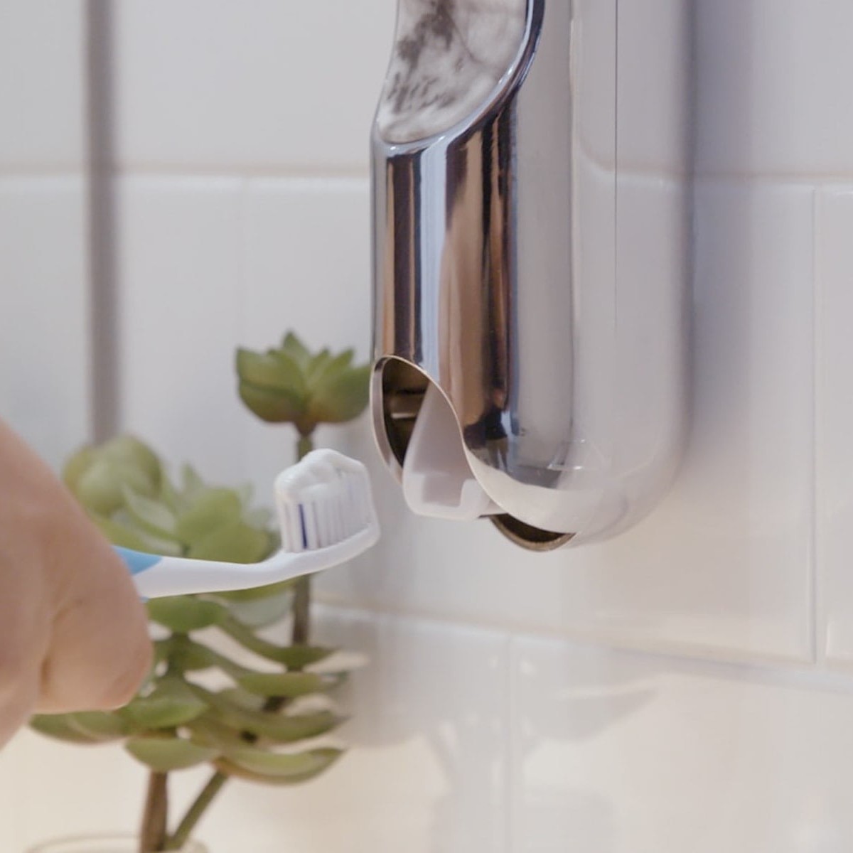 This stylish toothpaste dispenser makes it easier to keep your bathroom ...