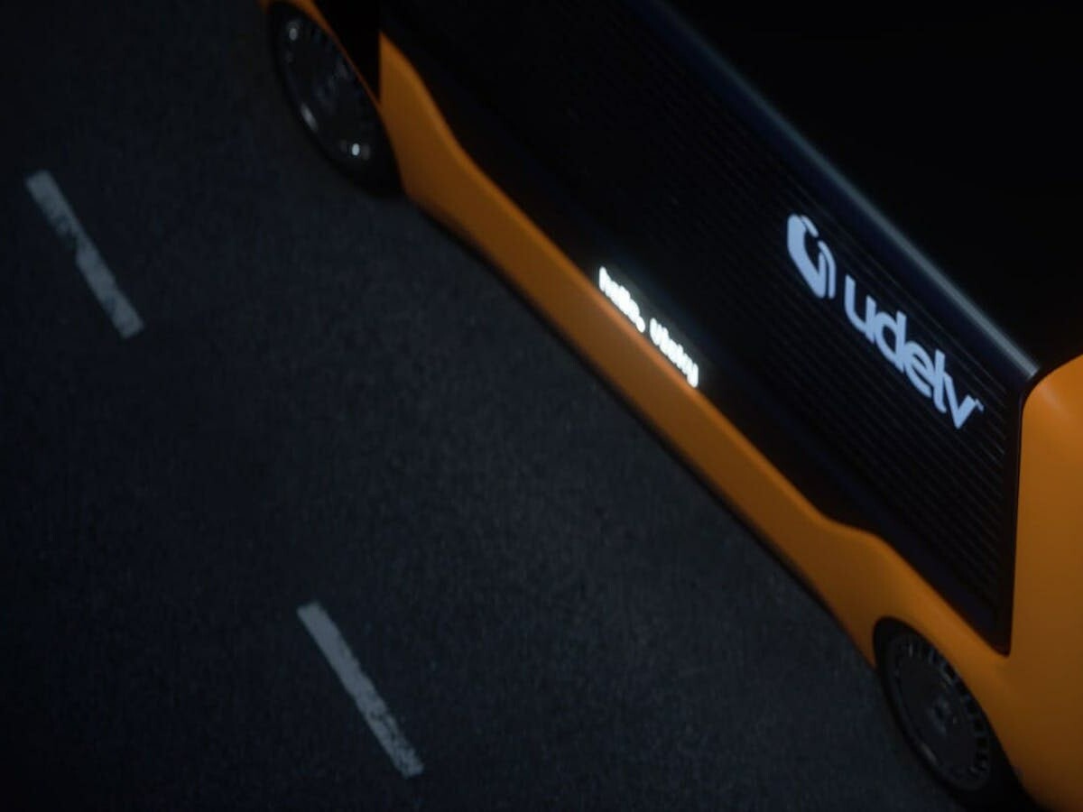 Udelv Transporter autonomous delivery vehicle delivers goods at a ...