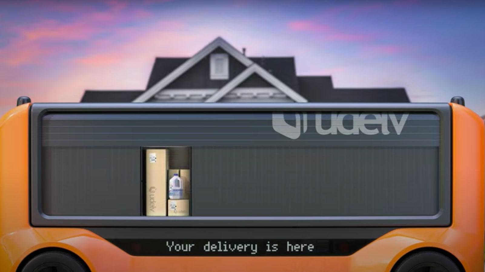 Udelv Transporter autonomous delivery vehicle delivers goods at a ...