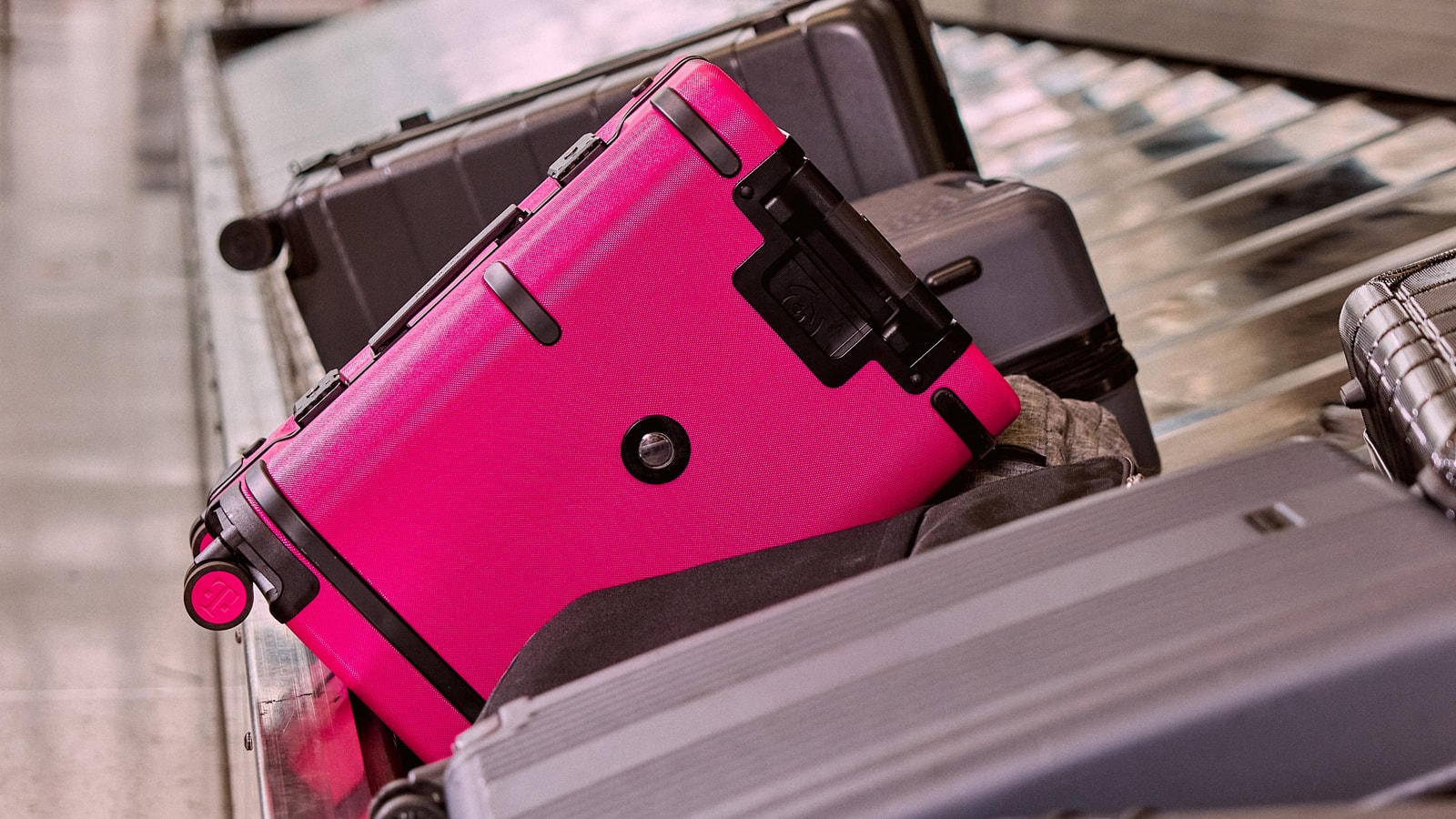 T-Mobile Un-carrier On smart magenta carry-on suitcase has wireless ...