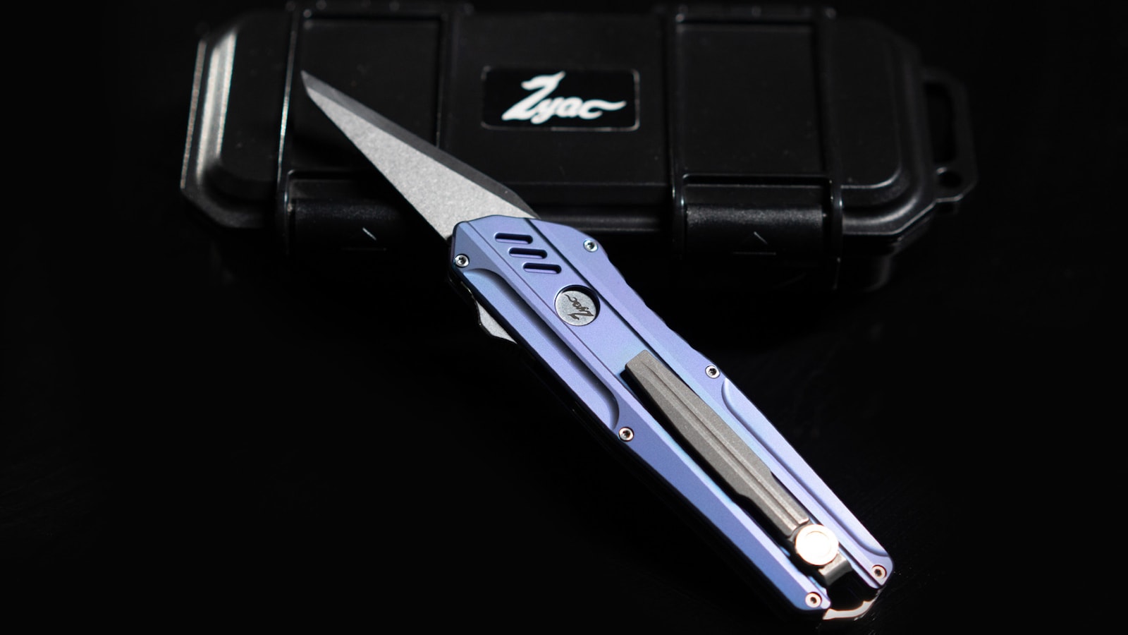 Titanium Dual-Action Automatic Utility Knife & Comb has a replaceable ...