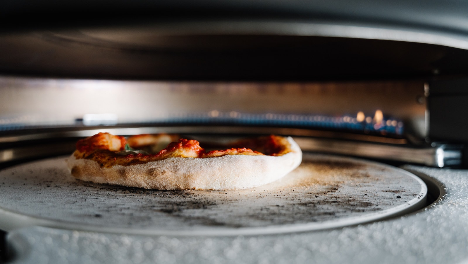 This 2-burner pizza oven cooks a 16" pizza in as few as 2 minutes