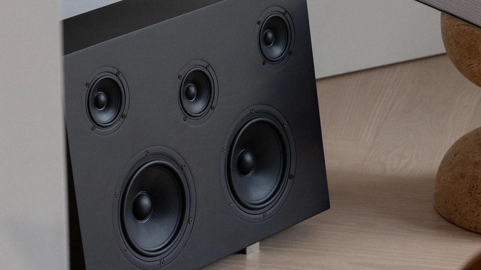 This raw wood speaker offers a harmonious blend of sound & design