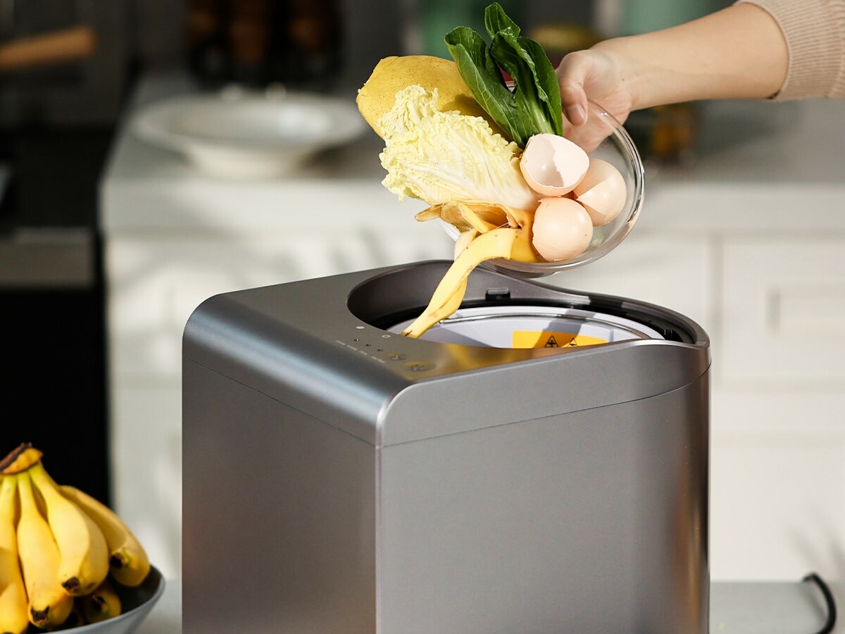 This electric kitchen composter recycles food scraps into garden gold