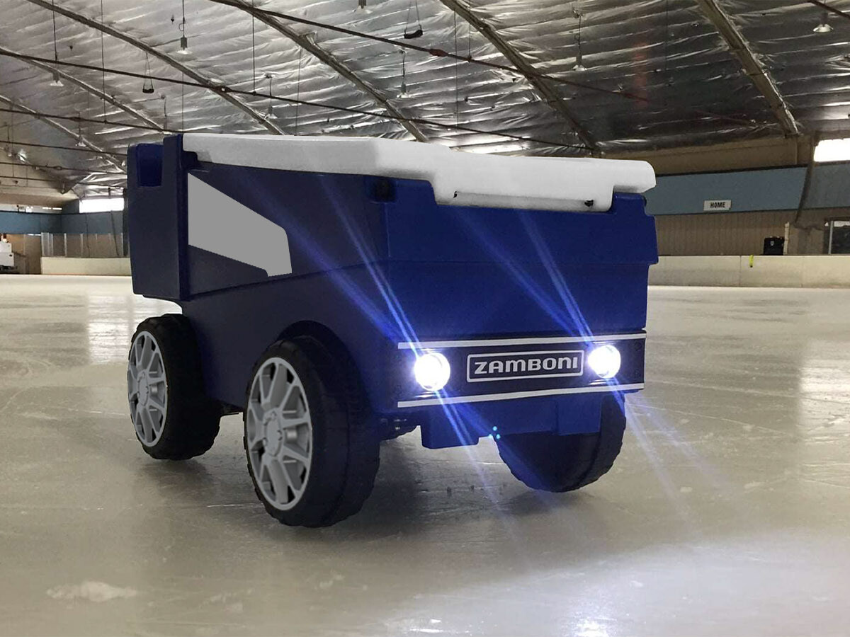 These custom coolers have LED headlights & Bluetooth speakers
