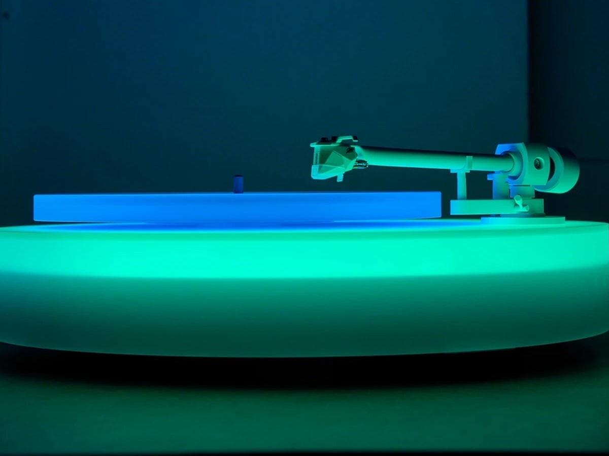 The Brian Eno TURNTABLE II glows different colors of neon as it plays