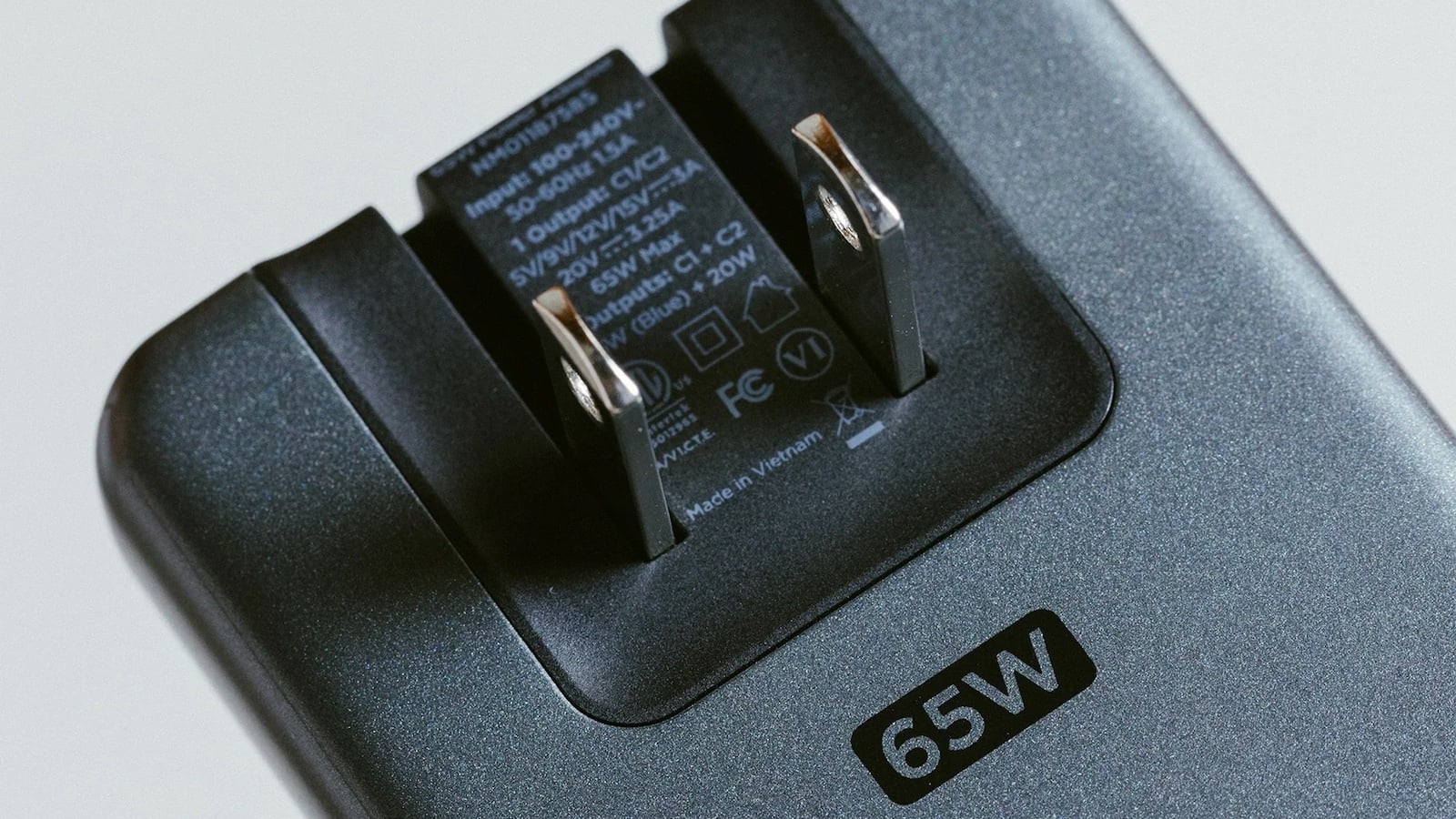 This slim power adapter by Nomad delivers 65W output